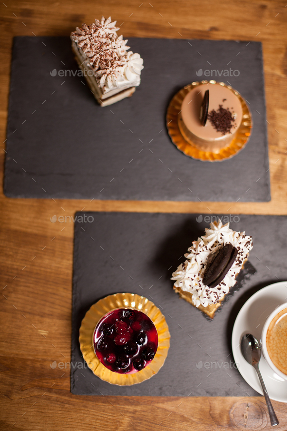 Top view of sweet decorated cake with fresh fruits in a coffee shop ...