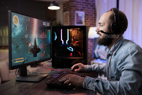 Cheerful person playing action shooting video games competition Stock ...