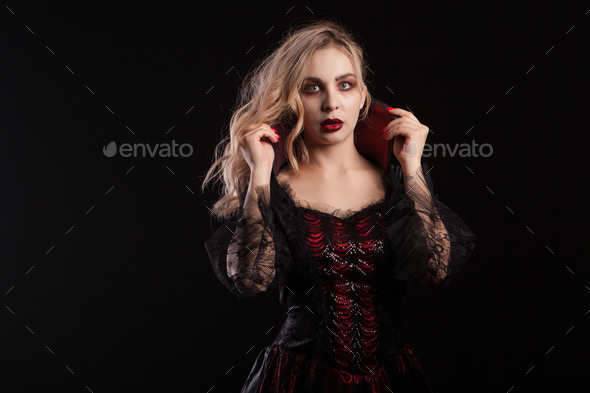 Beautiful vampire woman in a black dress for halloween Stock Photo by ...