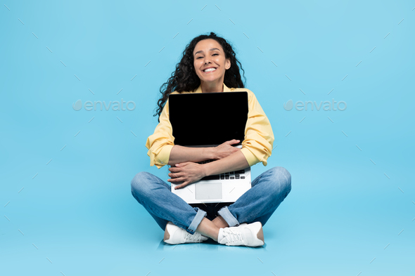 Middle Eastern Woman Hugging Laptop Computer Sitting On Blue Background ...
