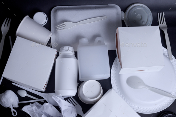 Plastic waste collection on dark background. Concept of recycling ...