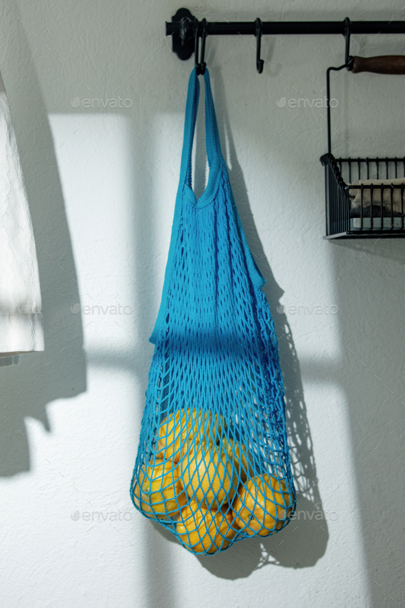 Blue net bag and lemons in kitchen Stock Photo by Masson-Simon | PhotoDune