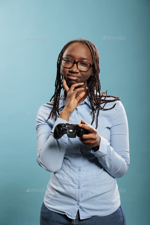 Sad adult gamer with videogame console modern controller losing online ...