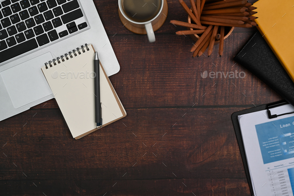 Top view laptop computer, notepad, coffee cup and succulent plant on ...