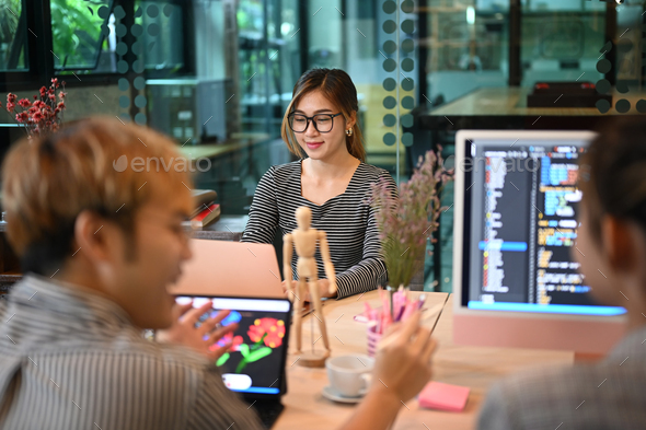 Software engineers brainstorming and working together in software ...