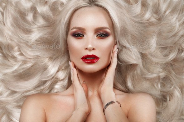 Beautiful Blonde In A Hollywood Manner With Curls Natural Makeup And