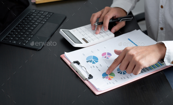 accounting man concept. businessman working using calculator with ...