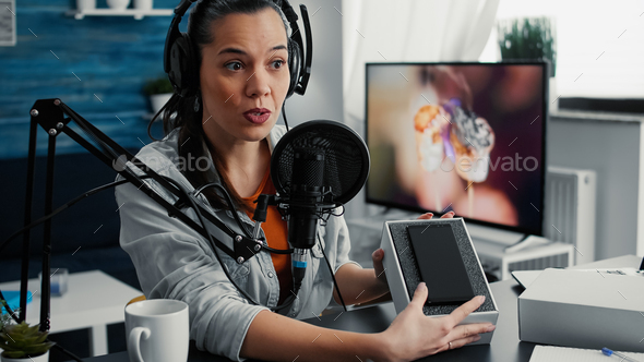 Tech enthusiast doing unboxing review video of new modern smartphone ...