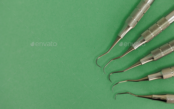 Set of different stainless steel dental instruments Stock Photo by borodai