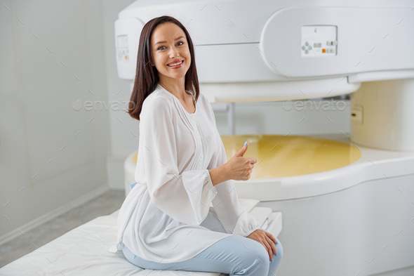 Happy patient after doing magnetic resonance imaging MRI or CT scan in ...
