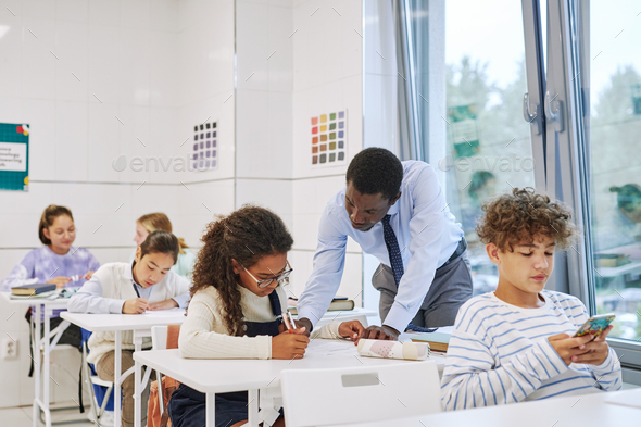 Children in School Classroom Stock Photo by seventyfourimages | PhotoDune