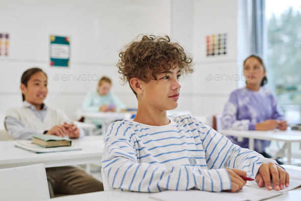 Teenage Boy in School Classroom Stock Photo by seventyfourimages ...