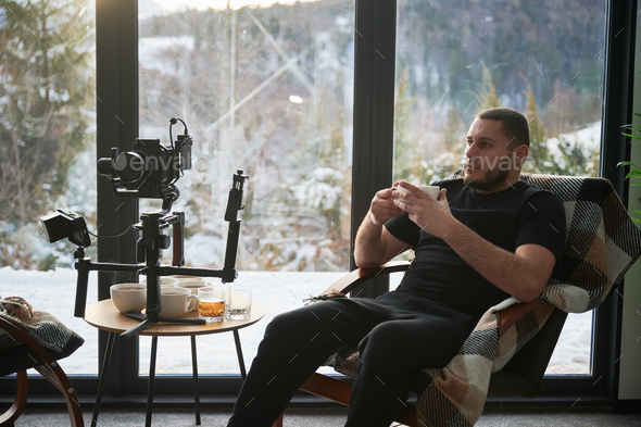 Videographer man with camera mounted on gimbal stabilizer equipment ...