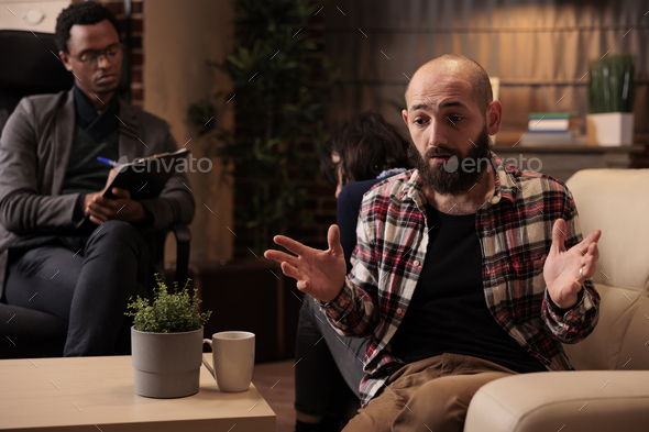 People sitting back to back arguing at couple therapy session Stock ...