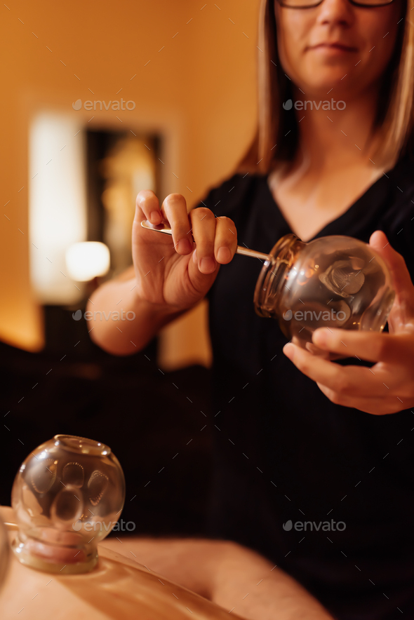 cupping therapy on the back of a man Stock Photo by Meniphoto | PhotoDune