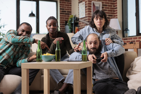 Group of young people having fun with video games competition Stock ...