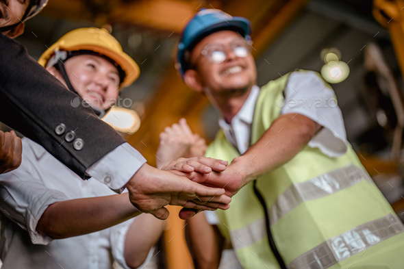 Hand coordination together of factory owner or manager, female ...