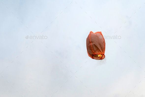 A picture of flying lantern in the sky Stock Photo by Yakov_Oskanov