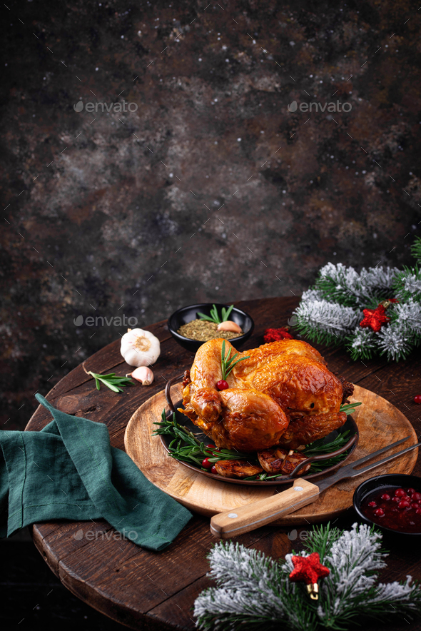 Christmas baked chicken for festive dinner. Stock Photo by furmanphoto