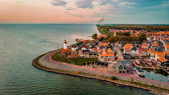 Urk Flevoland Netherlands sunset at the lighthouse and harbor of Urk ...