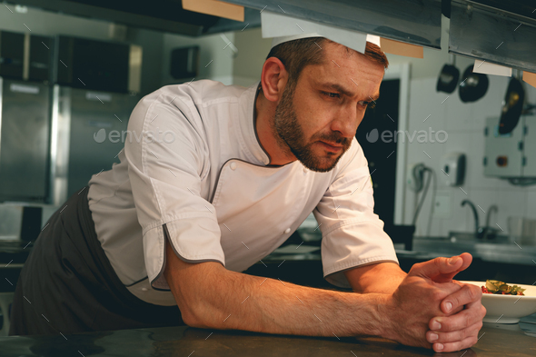 Tired chef on kitchen restaurant waiting for a new order Stock Photo by ...
