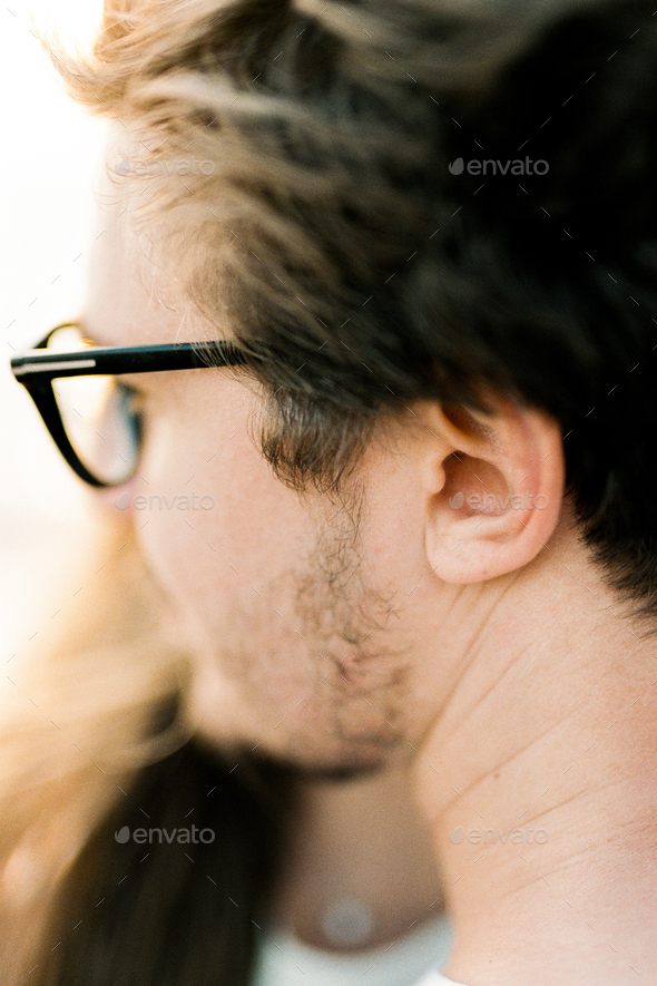 Male face with glasses. Side view. Close-up Stock Photo by Nadtochii