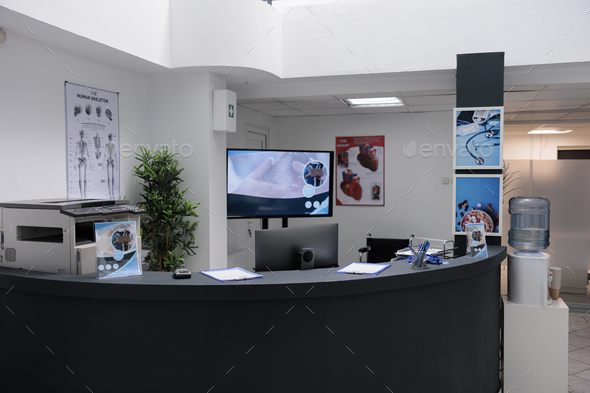 Nobody in hospital waiting room front desk with office supplies and ...