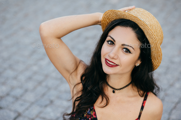 Portrait of lovely young female with dark luxurious hair, appealing ...