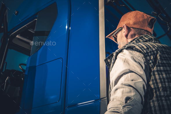 Semi Truck Driver and Ground Freight of Good Theme Stock Photo by duallogic