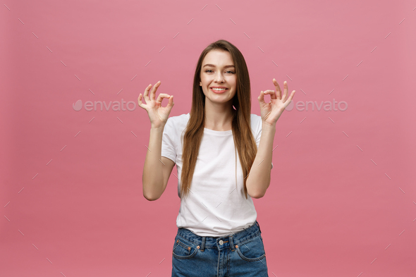 Attractive young adult woman showing ok sign. Expression emotion and ...