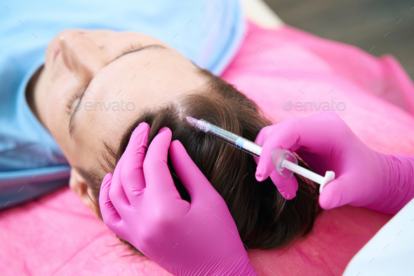 Man visiting beauty clinic for injections into head Stock Photo by ...
