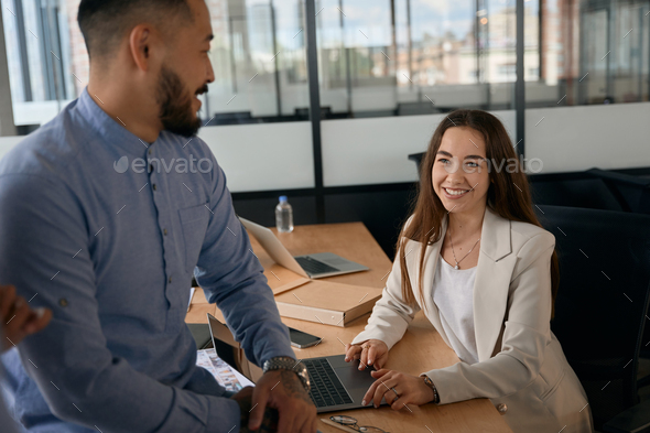 Confident man is talking and looking at his beautiful interlocutor ...