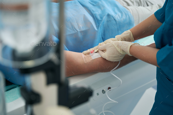 Patient in the hospital is put on a drip with medicine Stock Photo by ...
