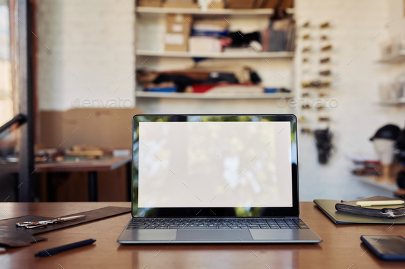 Laptop Mockup in Workshop Stock Photo by seventyfourimages | PhotoDune