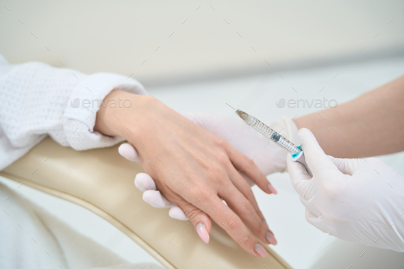 Close up of wrist injection for hand skin rejuvenation Stock Photo by ...