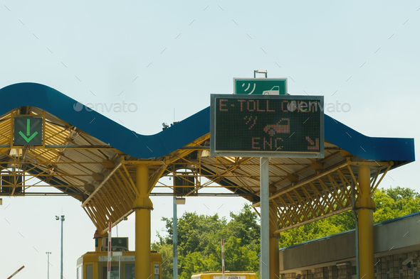 Expressway sign on tollgate shows way for cars closeup Stock Photo by ...