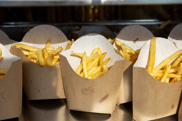 French fries in the package. Street food. Fast food. Stock Photo by yulikov