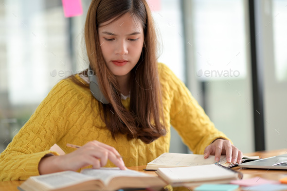 Female students reviewing lessons to prepare for final exams. Stock ...