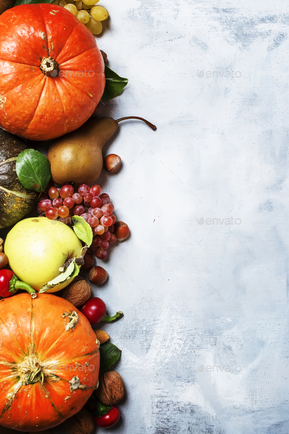 Autumn food background with pumpkins, vegetables, fruits and nuts ...