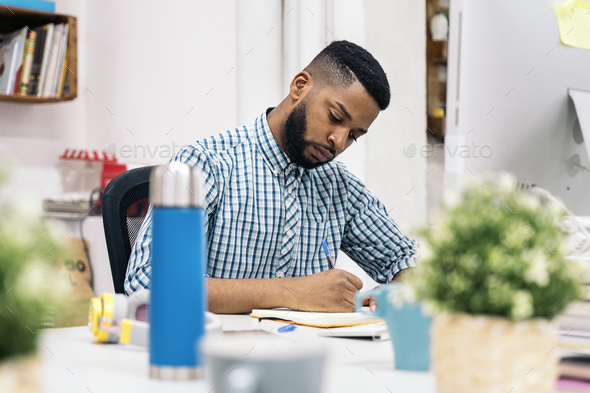 African Office Worker Doing Paper Work Stock Photo by nunezimage ...