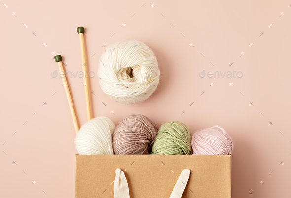 Craft hobby background with yarn in natural colors Stock Photo by OksaLy