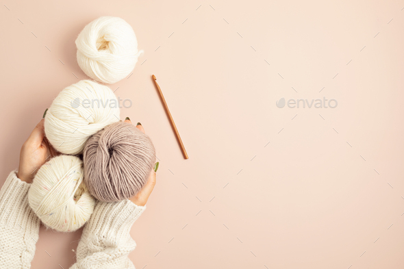 Craft hobby background with yarn in natural colors Stock Photo by OksaLy
