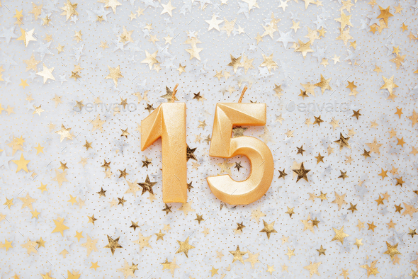 Number 15 fifteen golden celebration birthday candle on Festive ...