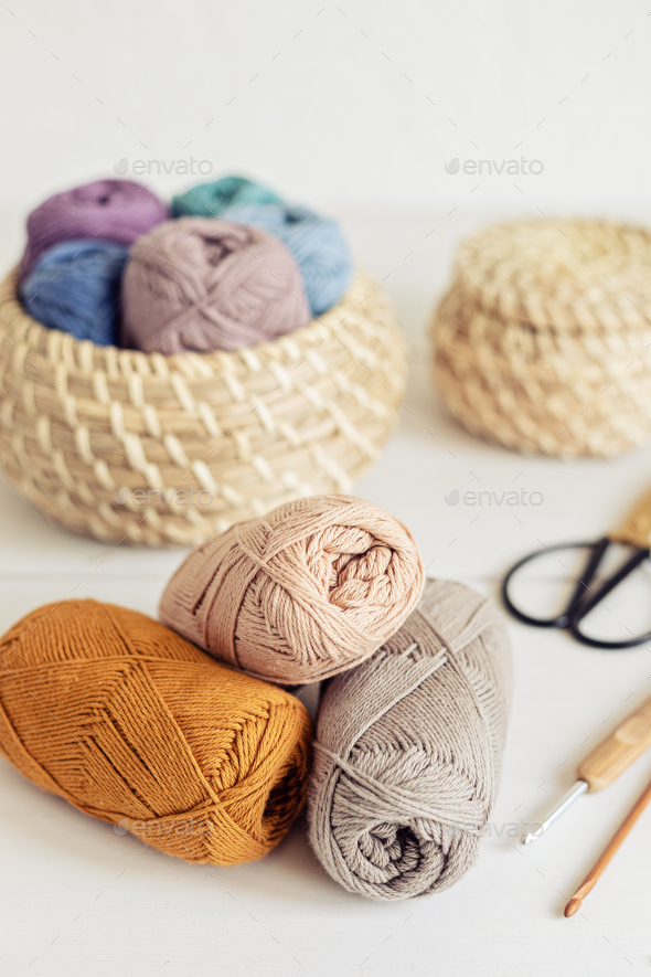 Craft hobby background with yarn in natural colors Stock Photo by OksaLy