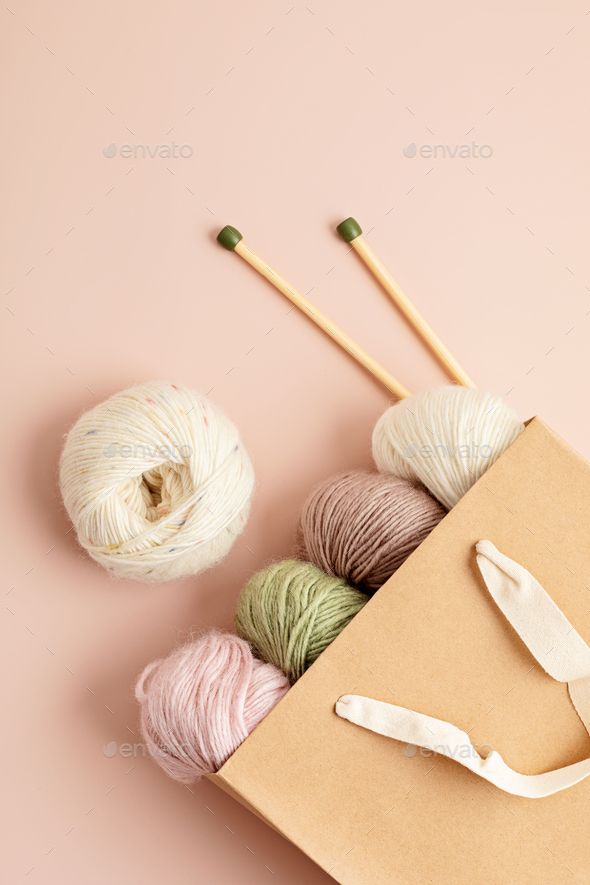 Craft hobby background with yarn in natural colors Stock Photo by OksaLy