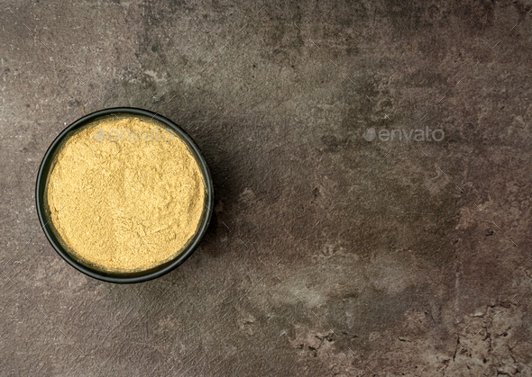 Aromatic Ginger powder from a flat lay angle with a dramatic dark ...