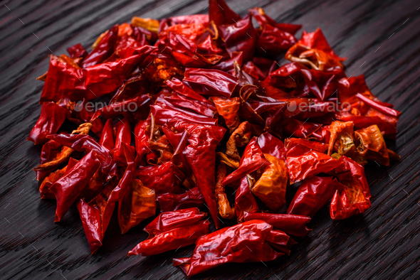 Pieces of dried paprika, preparation of powder spice for various dishes ...