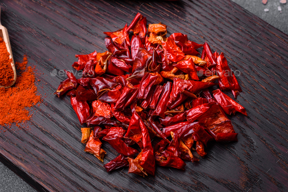 Pieces of dried paprika, preparation of powder spice for various dishes ...