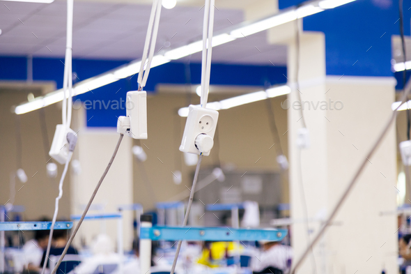 Electrical wiring for sewing machines in a sewing workshop Stock Photo ...