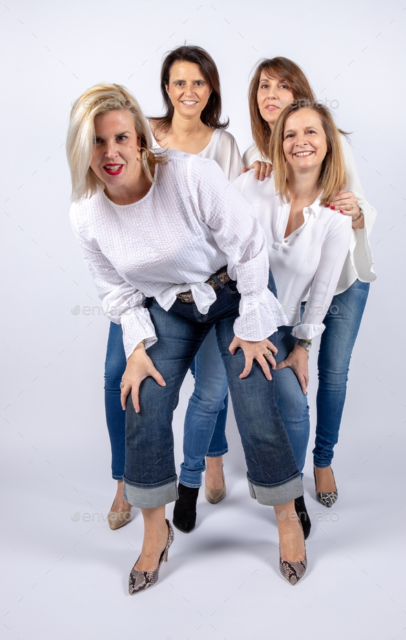 Female executives standing behind each other Stock Photo by Luisbaneres
